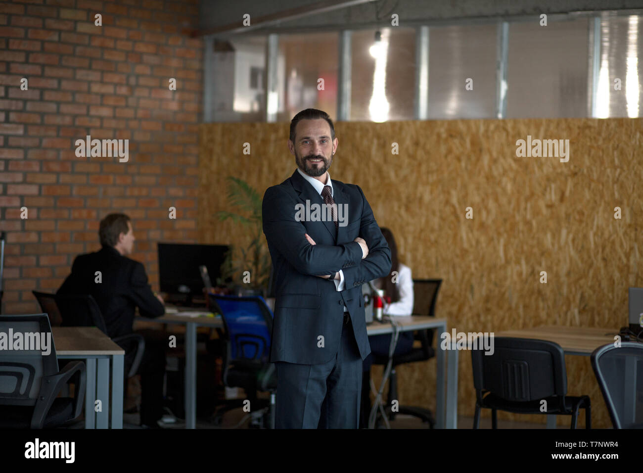 Businessman In Suit Standing Middle Office With Crossed Hands ...