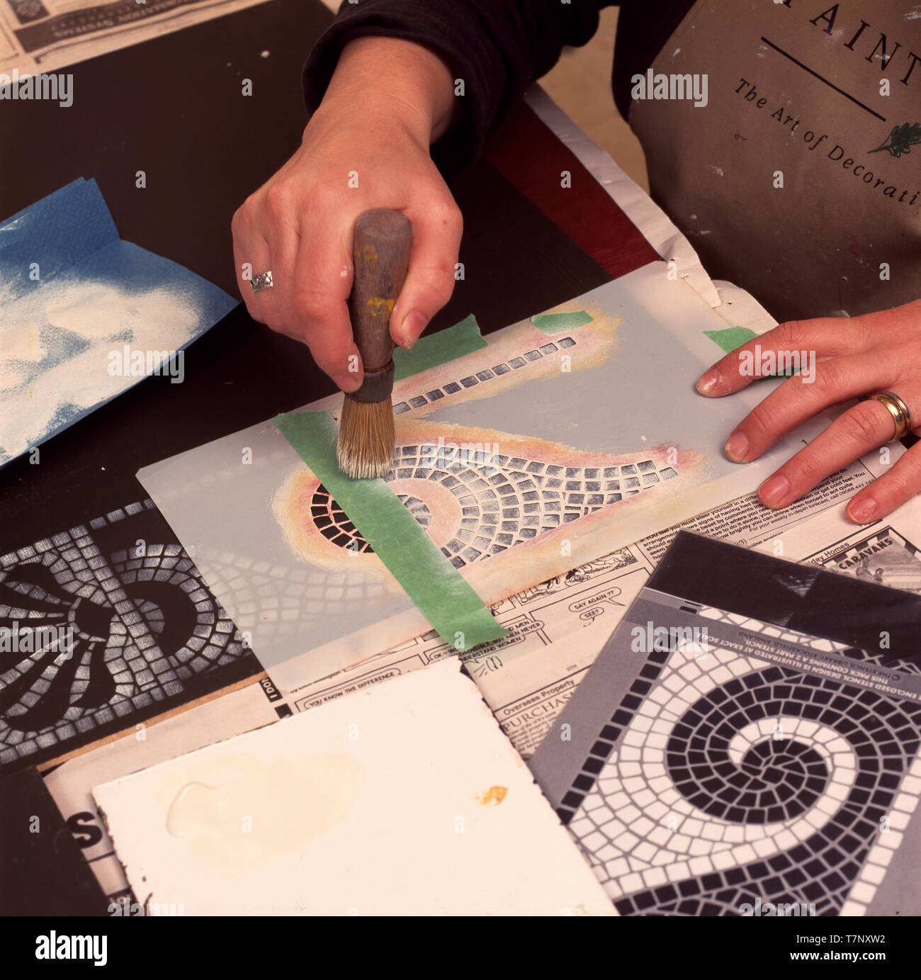 Mosaic tiles hands hi-res stock photography and images - Alamy