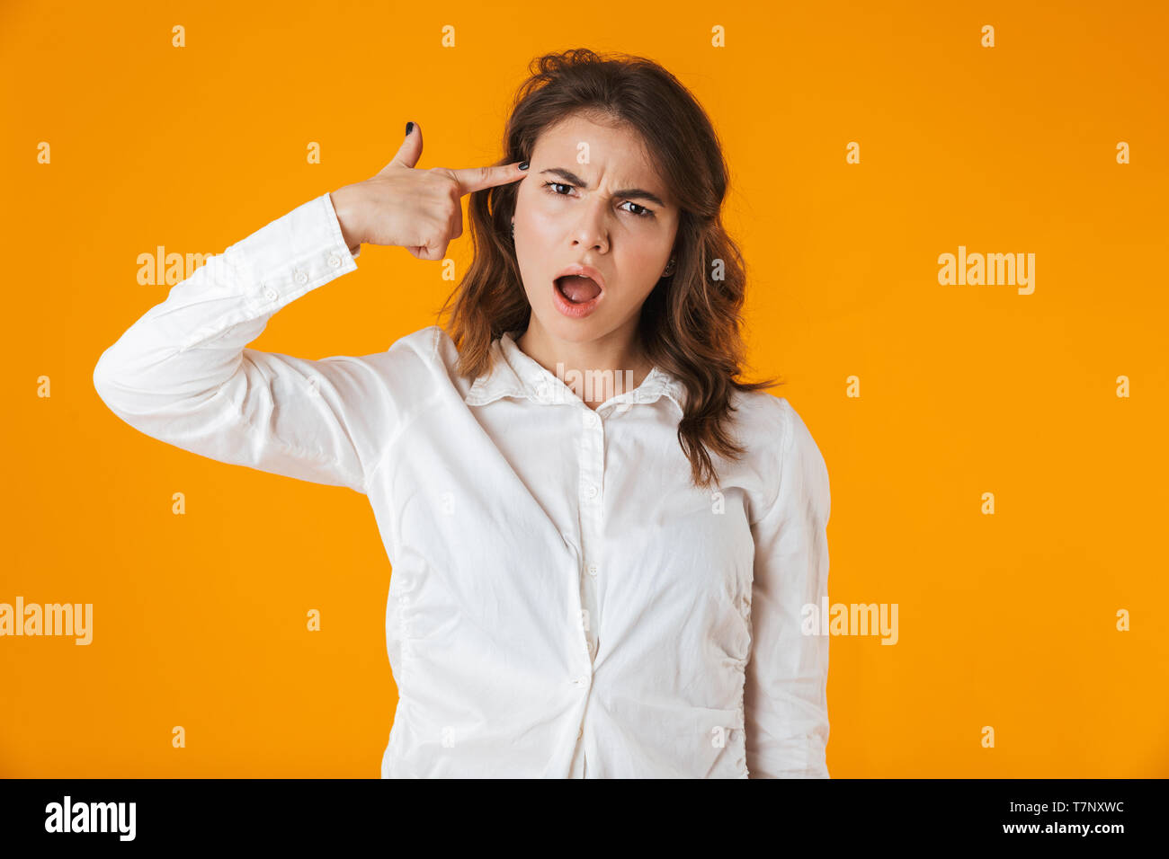 beautiful woman pointing to forehead Stock Photo - Alamy