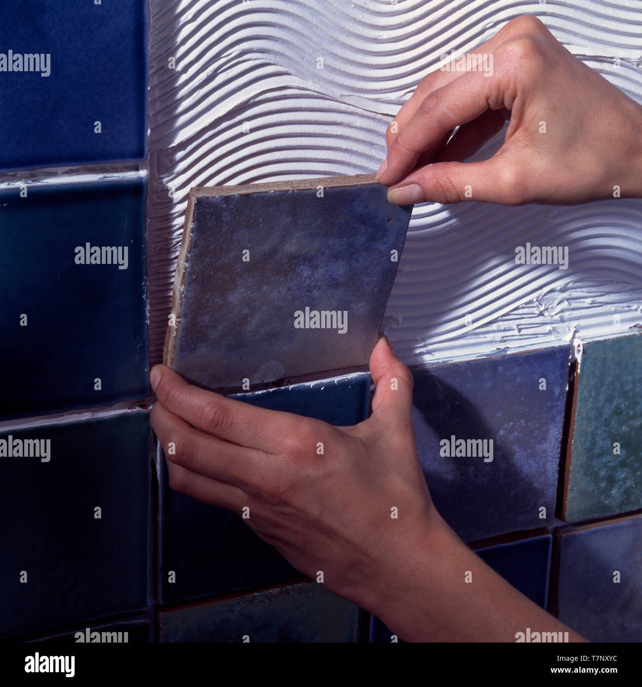 Hands fixing hi-res stock photography and images - Alamy