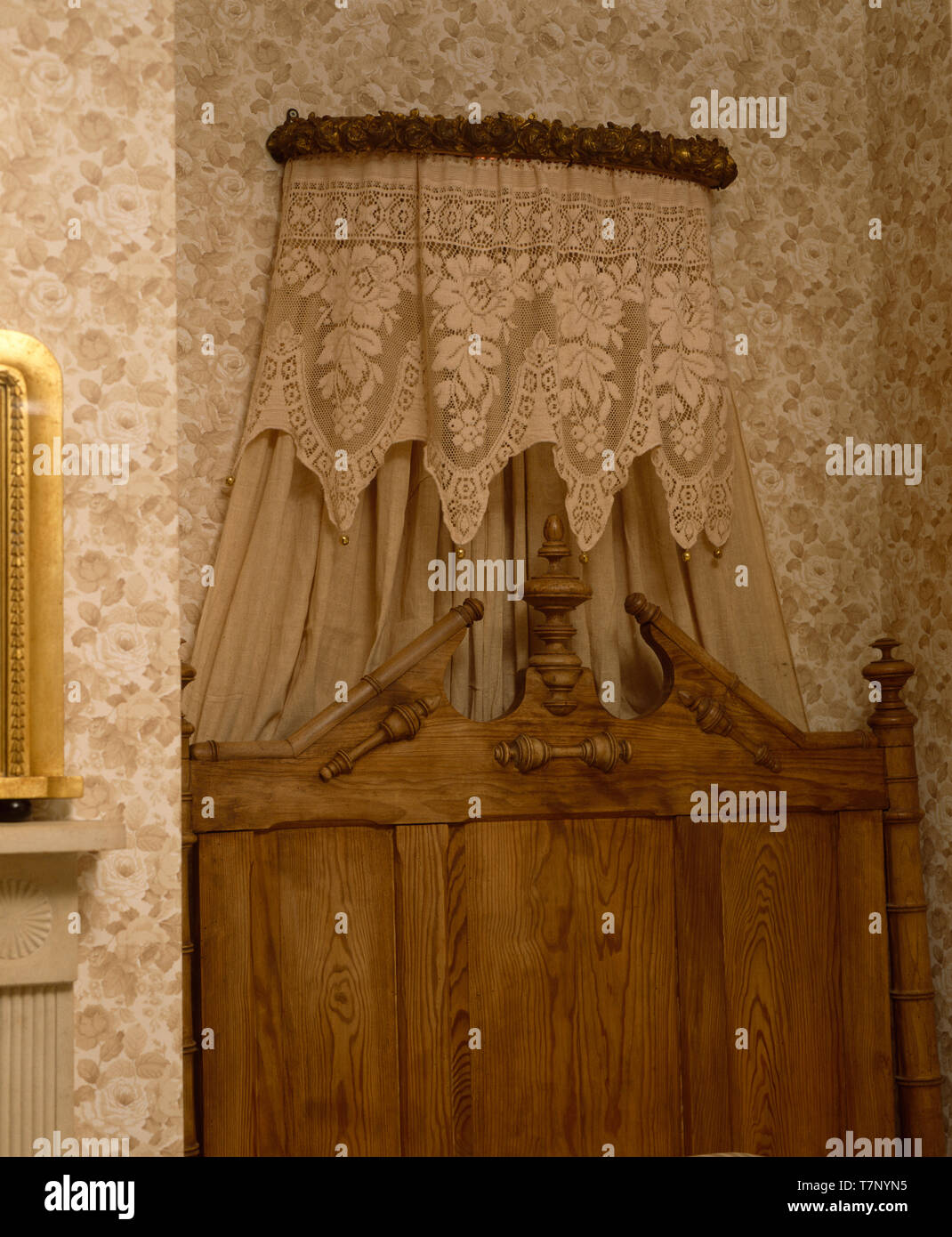 Vintage lace canopy above pine bed Stock Photo - Alamy