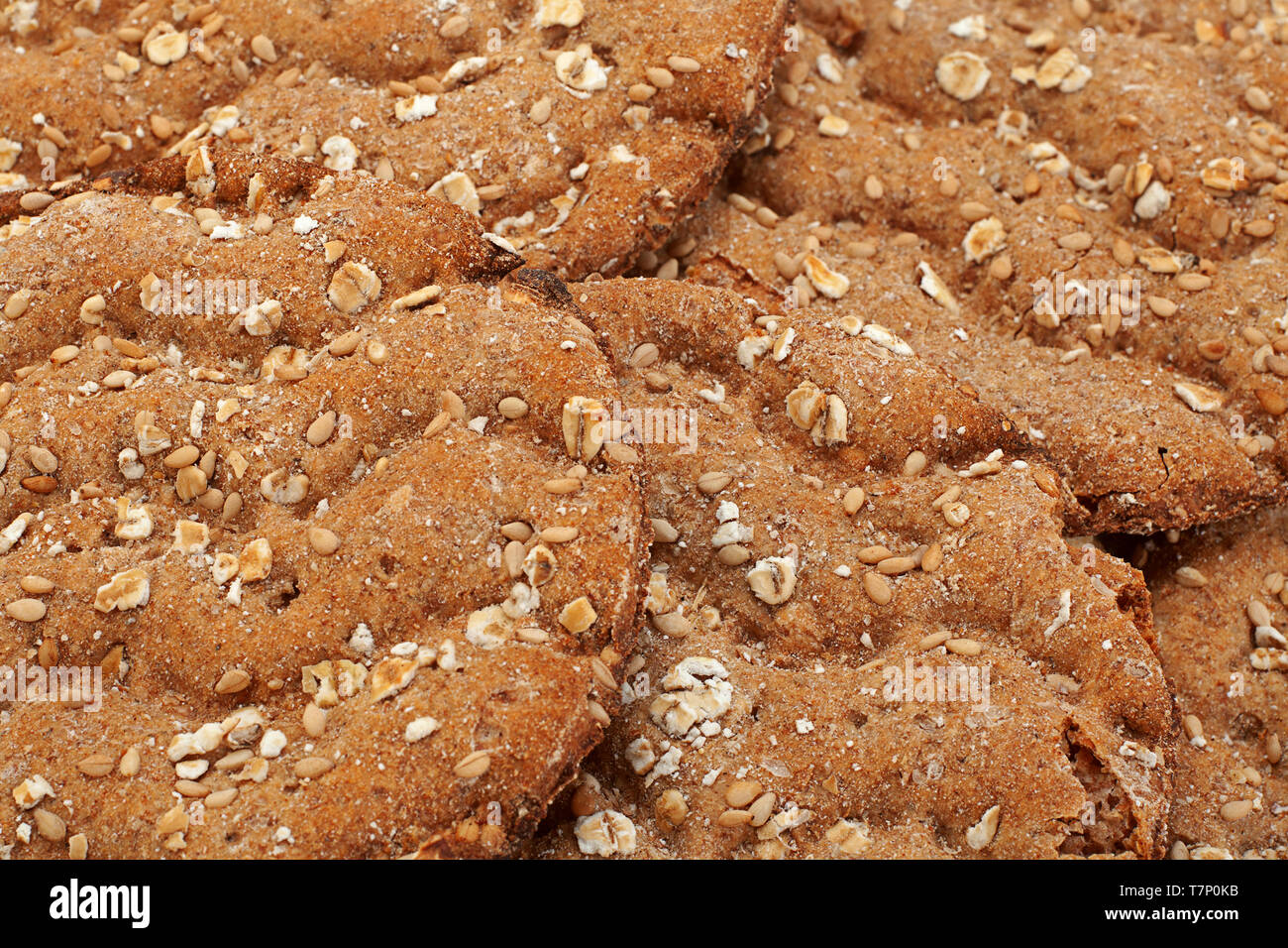 Whole grain rye brown crispbread closeup background Stock Photo - Alamy