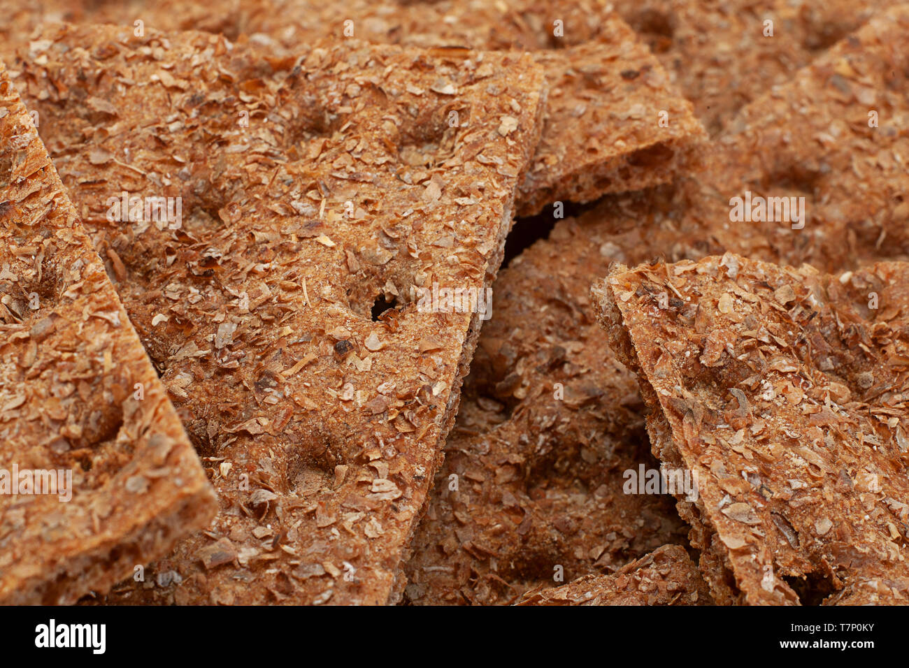 Whole grain rye brown crispbread closeup background Stock Photo - Alamy