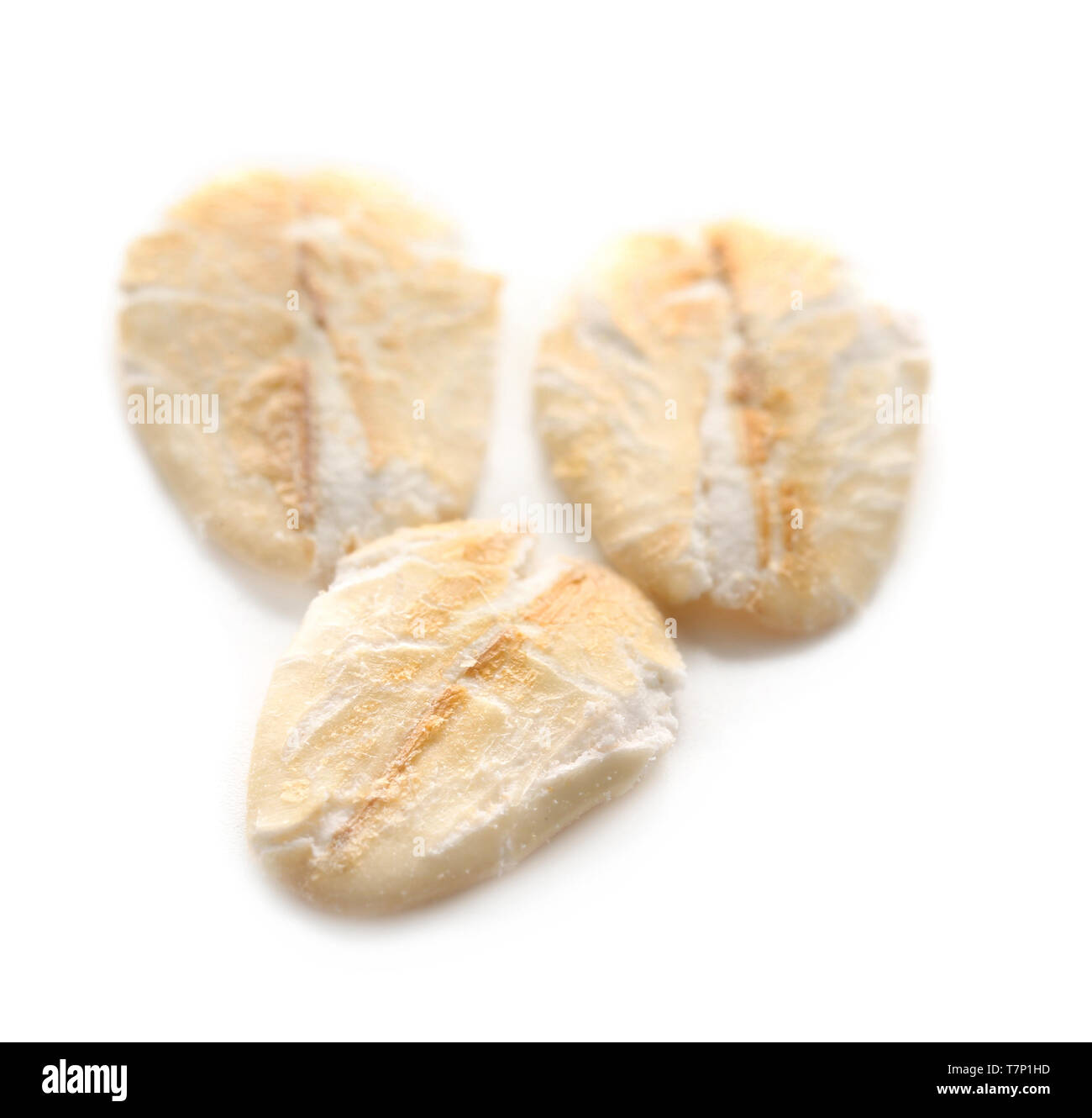 Raw oatmeal on white background Stock Photo - Alamy