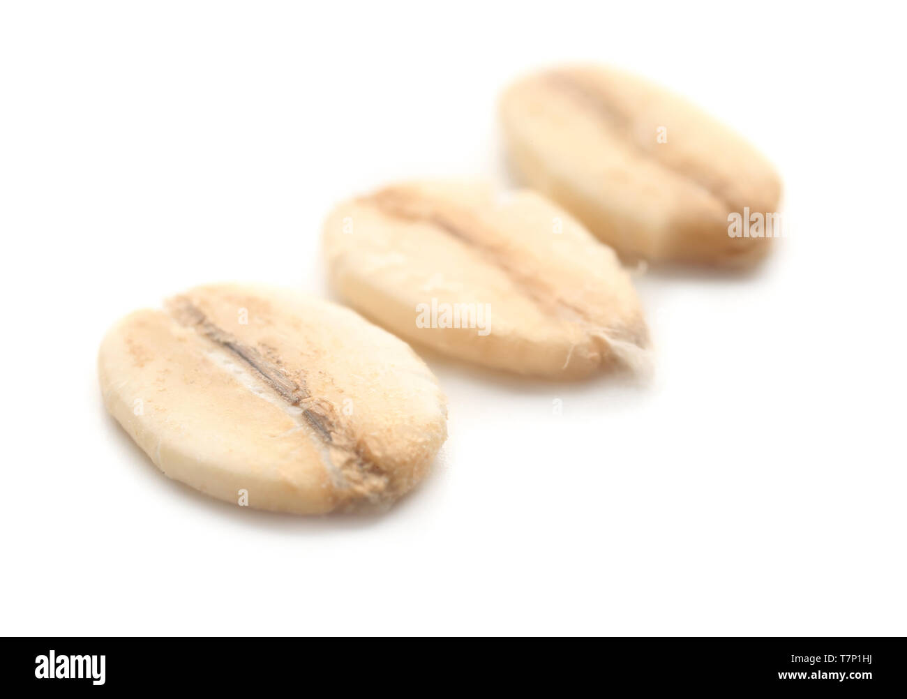 Raw oatmeal on white background Stock Photo - Alamy