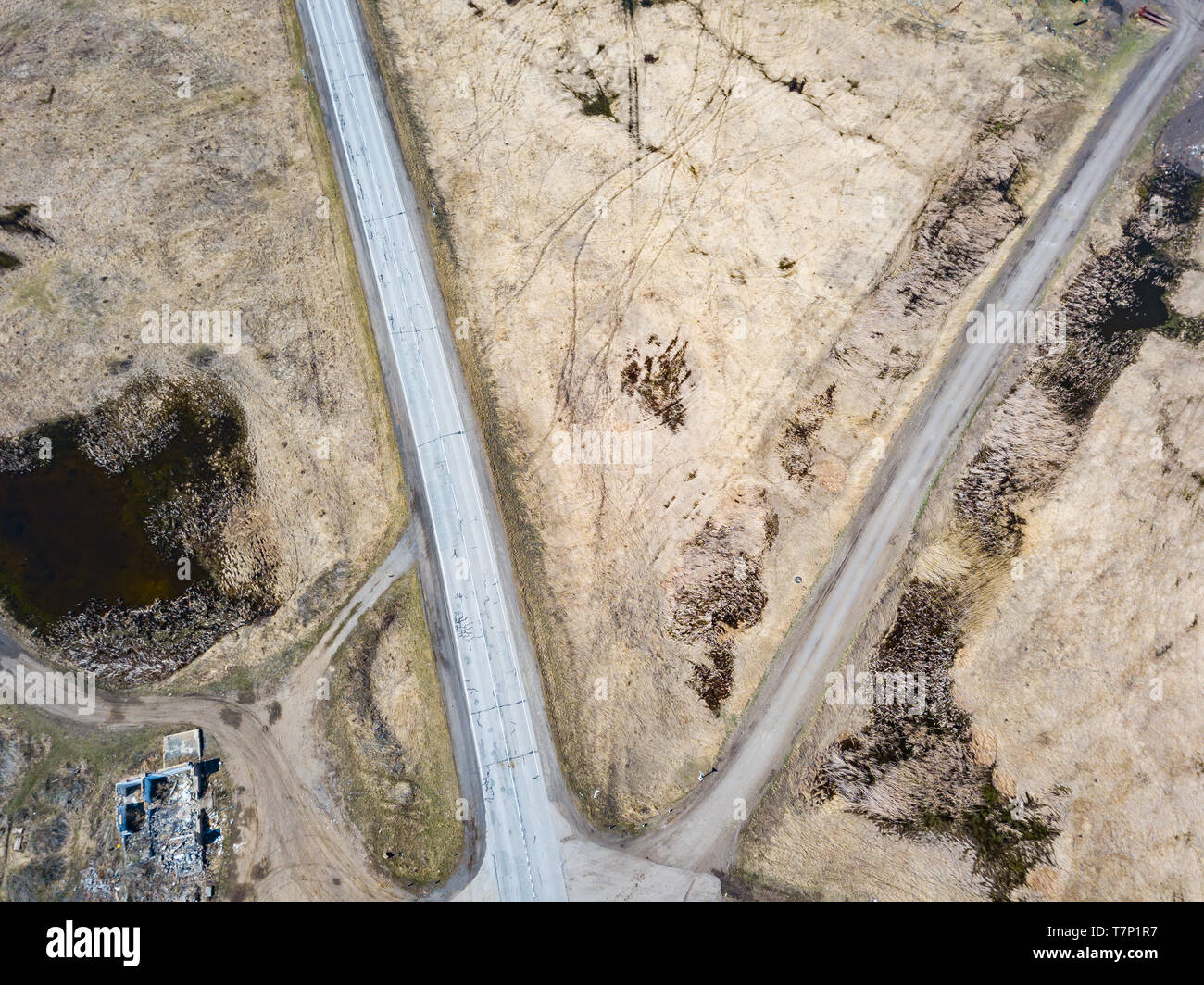 Aerial view of the intersection of asphalt and ground roads in the ...