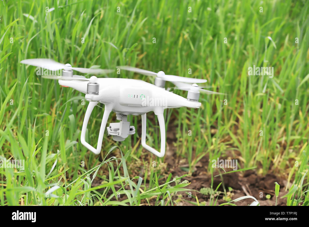 Flying quadcopter over grass hi-res stock photography and images - Alamy