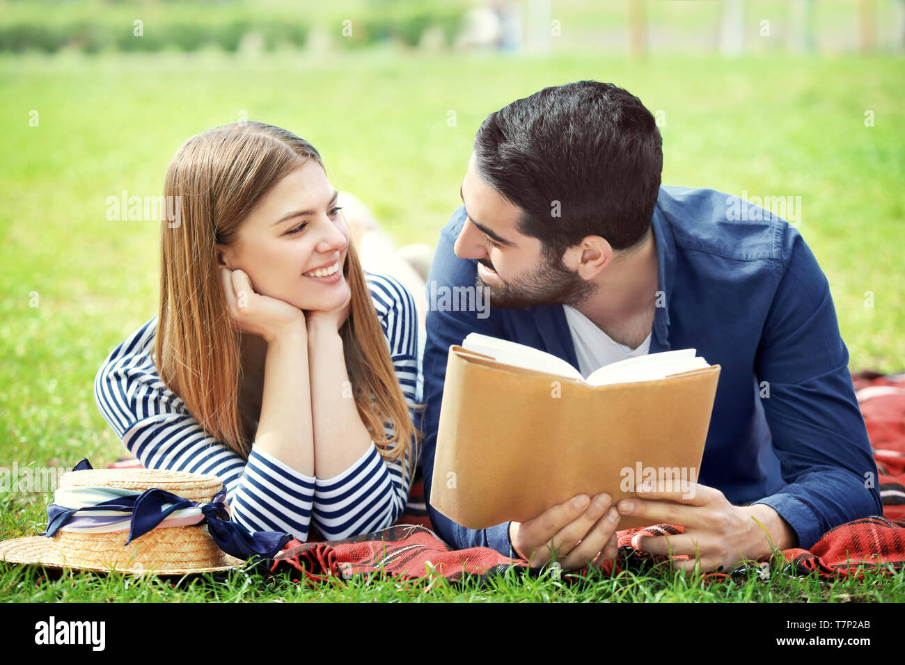 Happy lovely couple reading book hi-res stock photography and images ...