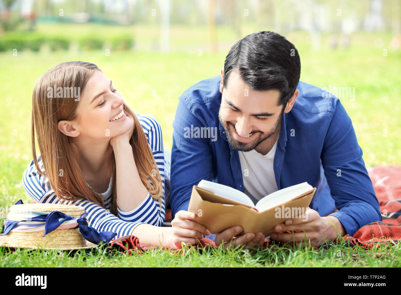 Happy lovely couple reading book hi-res stock photography and images ...