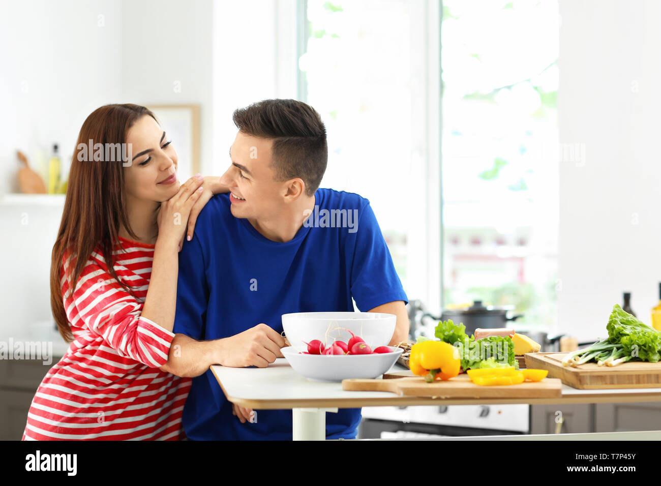 Young lovely couple in kitchen Stock Photo - Alamy