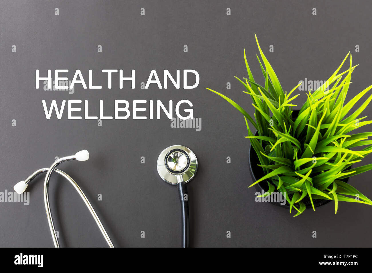 Health and well being text and stethoscope health and medical concept ...