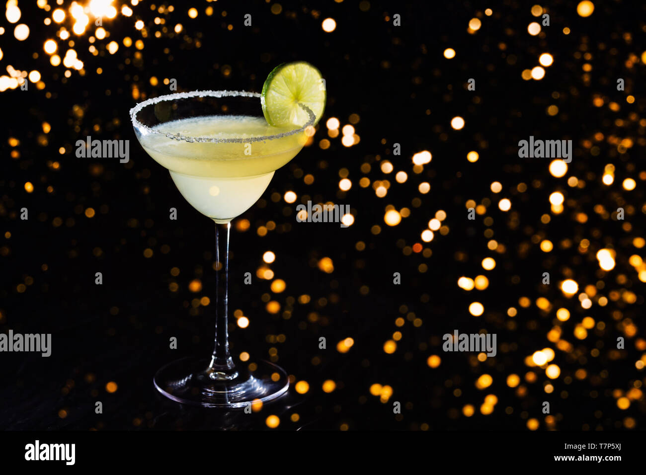 Classic daiquiri on the dark background with festive holiday bokeh ...