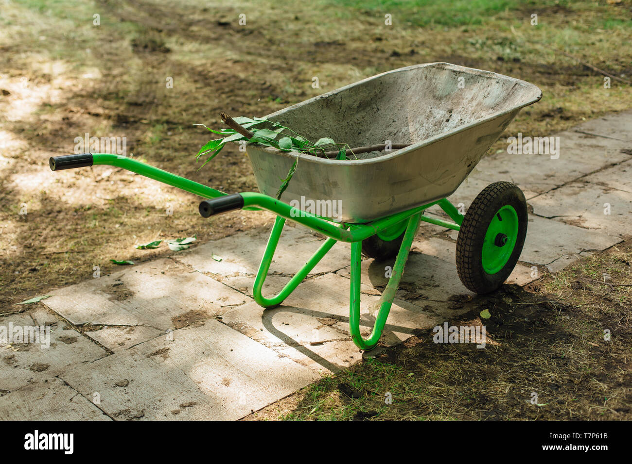 Iron trolley for manual moving of building materials in the garden and ...