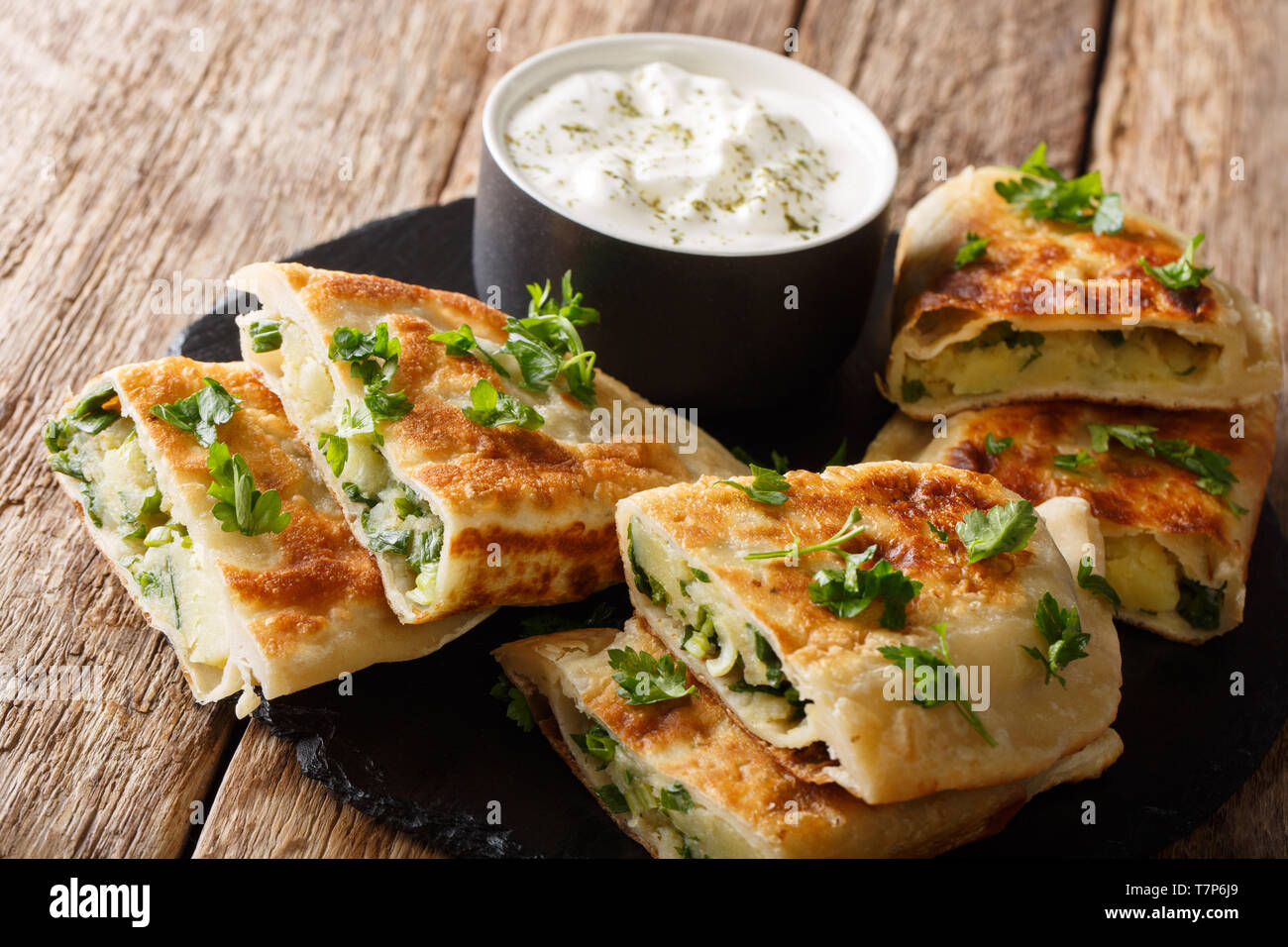 Traditional afghan friedflat bread bolani with potatoes, green onions ...