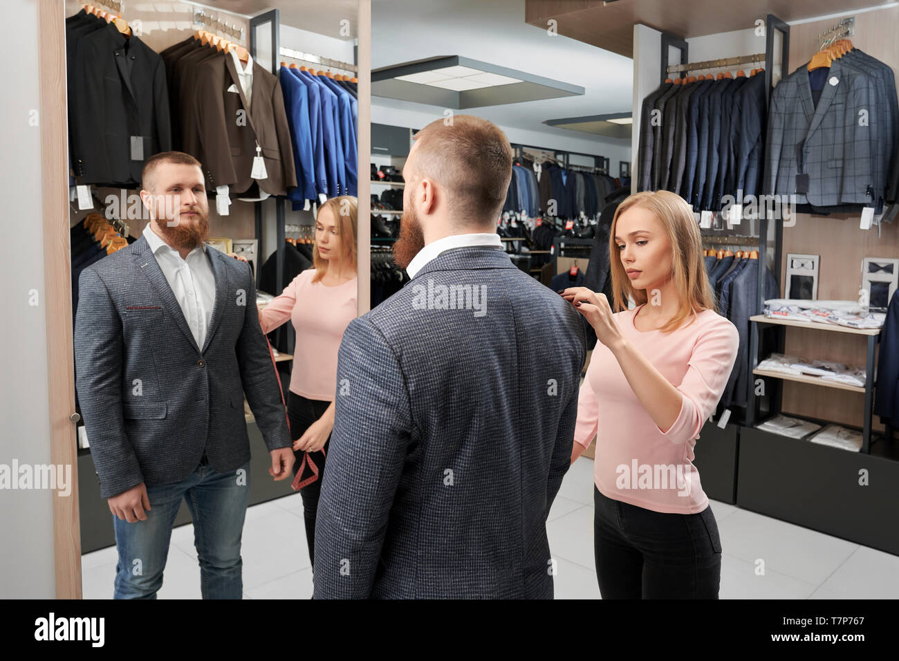Male shop assistant clothes shop hi-res stock photography and images ...
