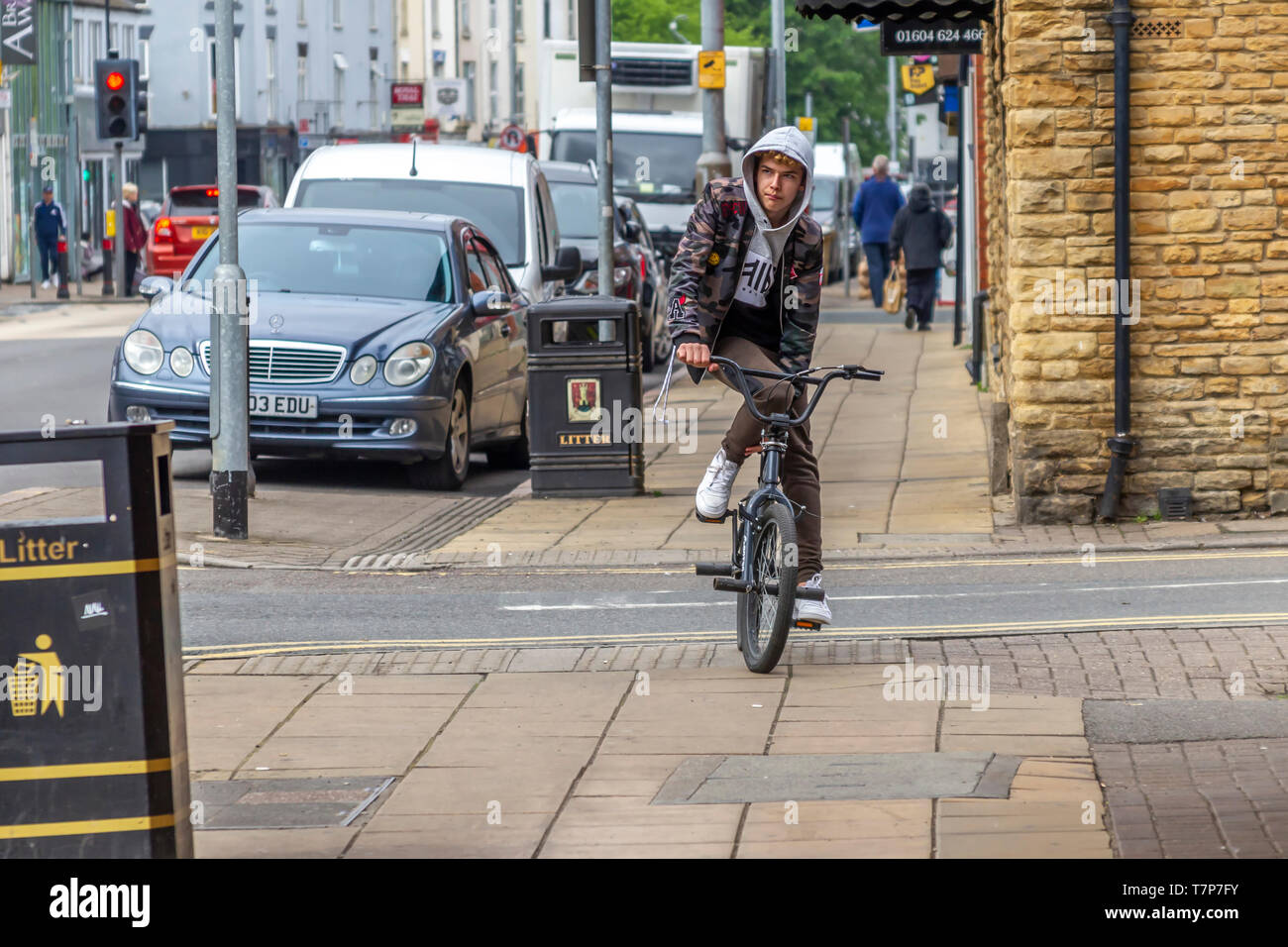 Cyclist riding on pavement hi-res stock photography and images - Alamy
