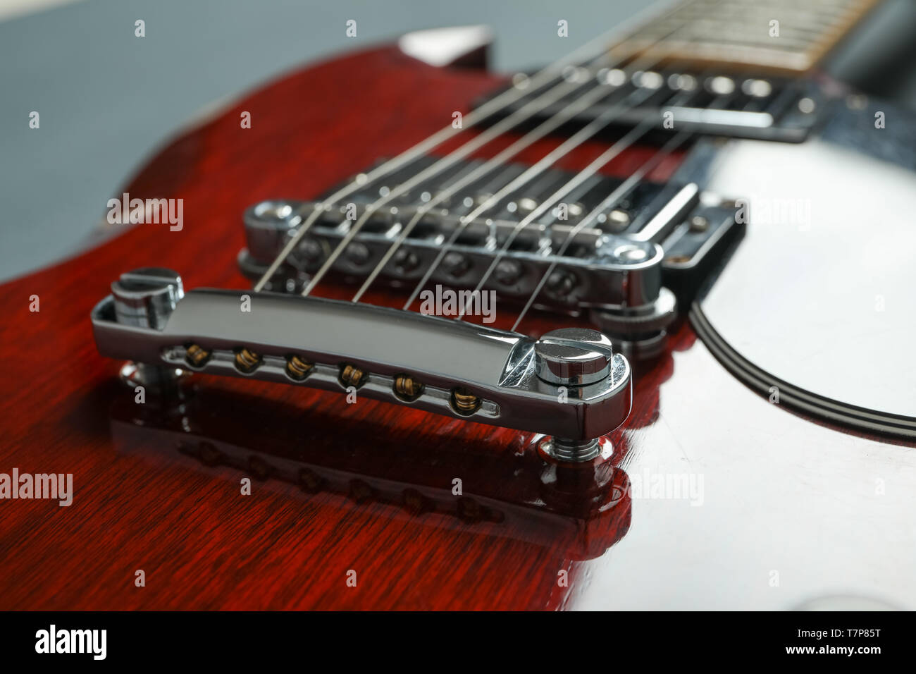 Beautiful six - string electric guitar on dark background, closeup ...