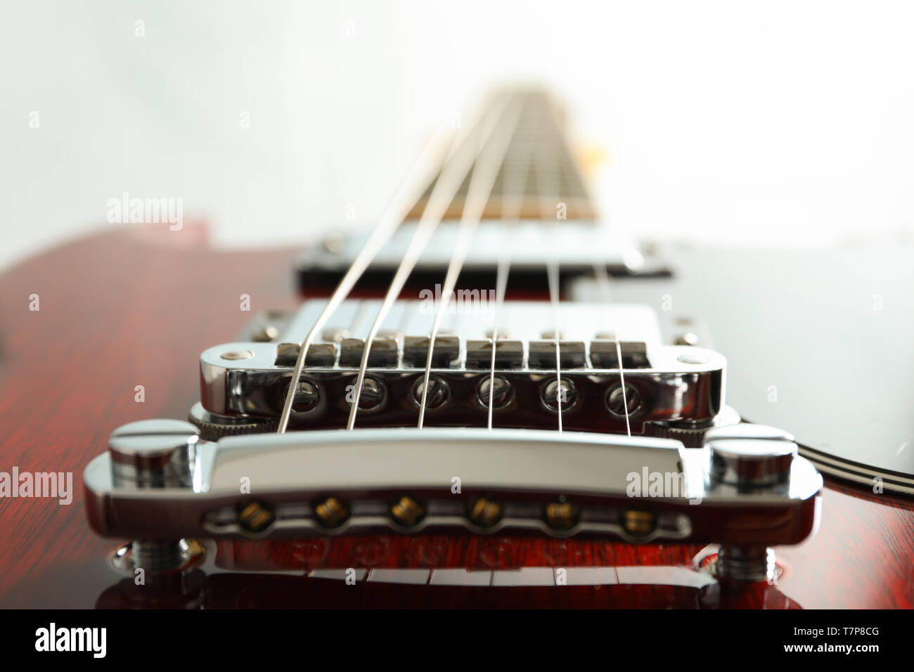 Beautiful six - string electric guitar on white background, closeup ...