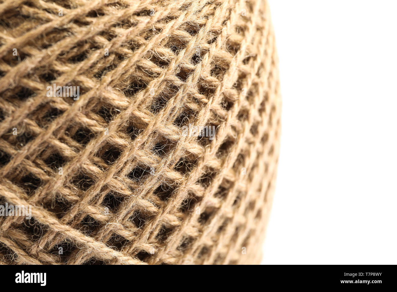 Spool of hemp rope on white background Stock Photo - Alamy