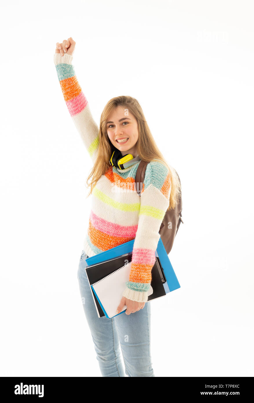 Beautiful millennial teenager girl with backpack and folder smiling and ...