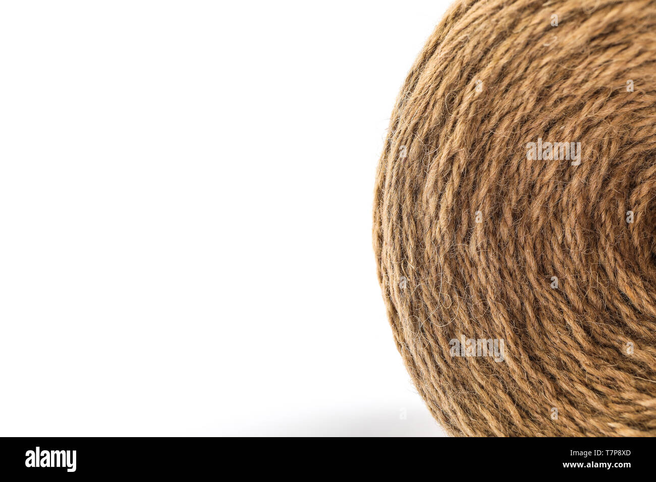 Spool of hemp rope on white background Stock Photo - Alamy