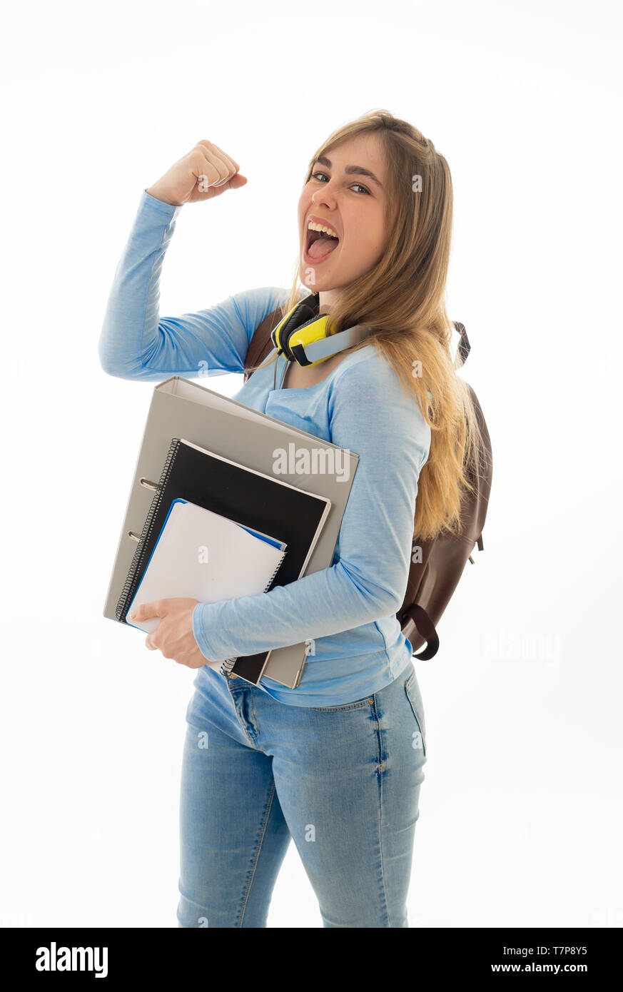 Beautiful millennial teenager girl with backpack and folder smiling and ...