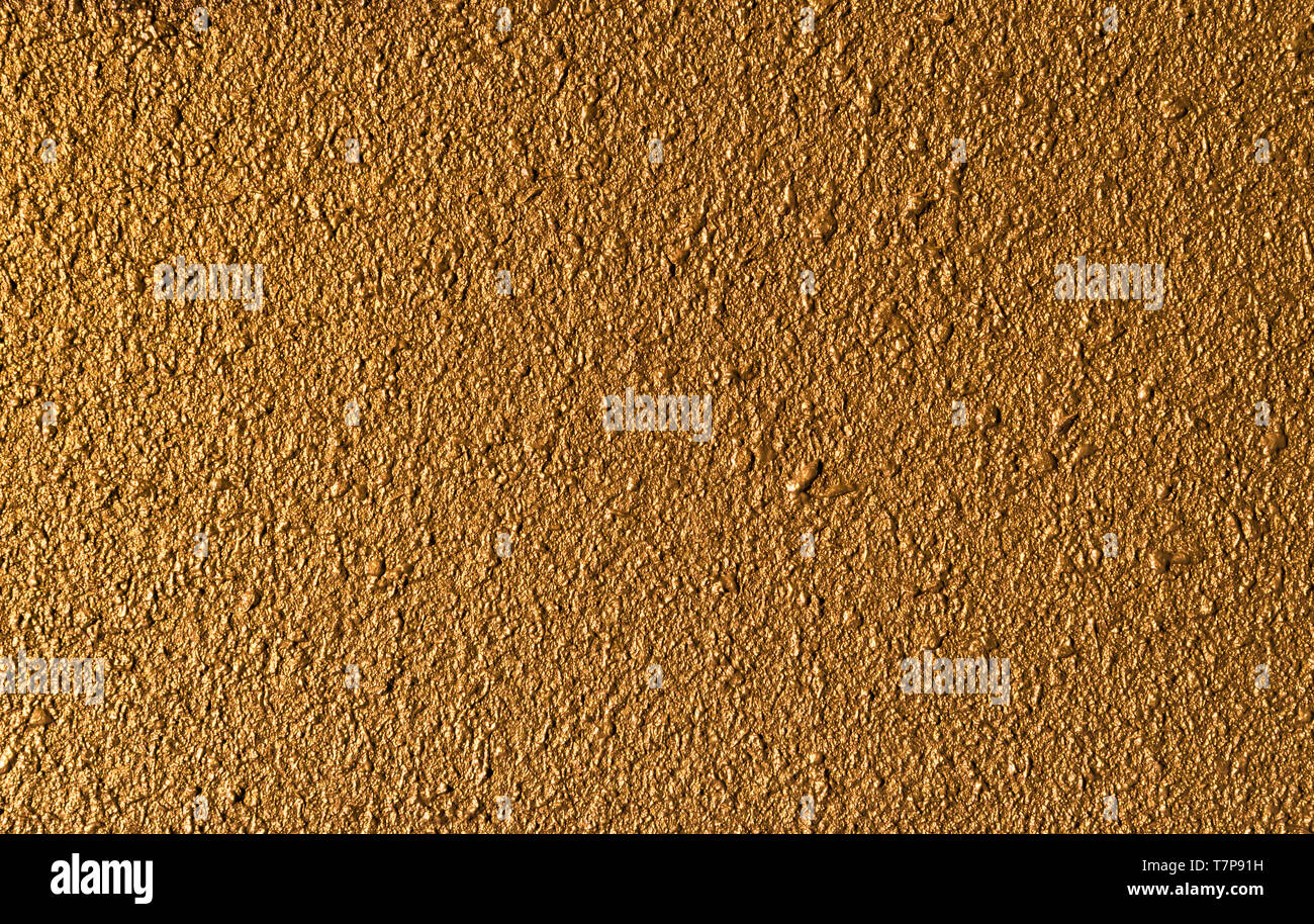 Golden concrete wall with rough surface as background Stock Photo - Alamy