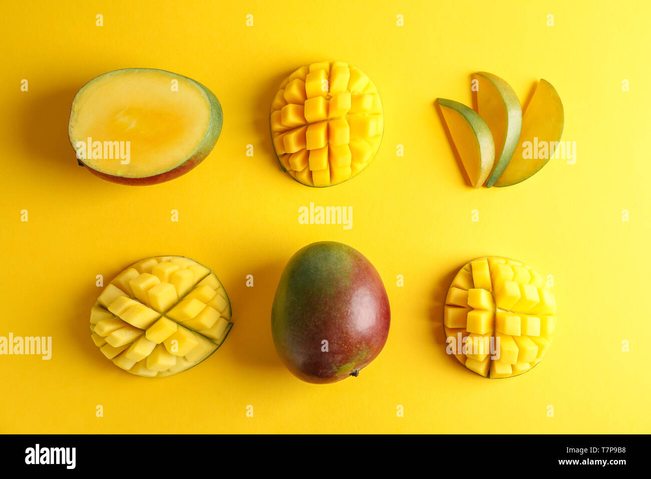 Flat lay composition with ripe mangoes on color background Stock Photo ...