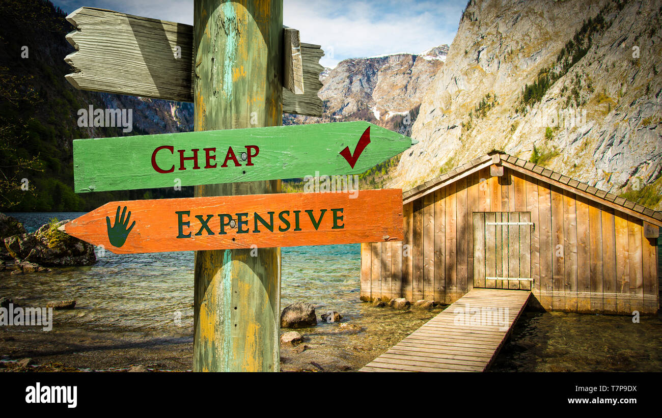 Street Sign the Direction Way to Cheap versus Expensive Stock Photo - Alamy