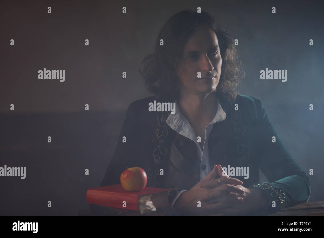 History of science, concept. Isaac Newton with Apple in hand. Gravity ...