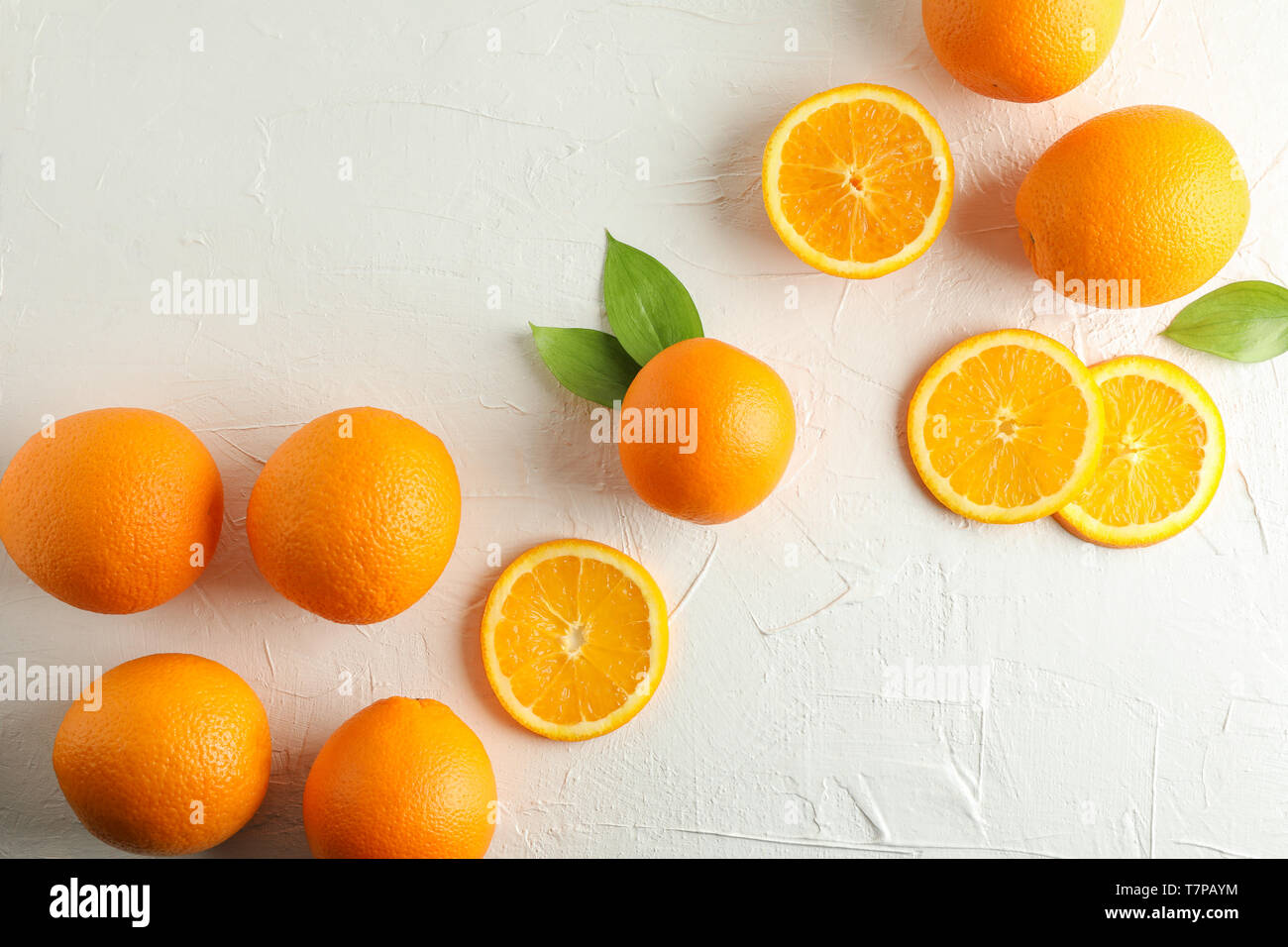 Flat lay composition with ripe oranges on white background. Top view ...