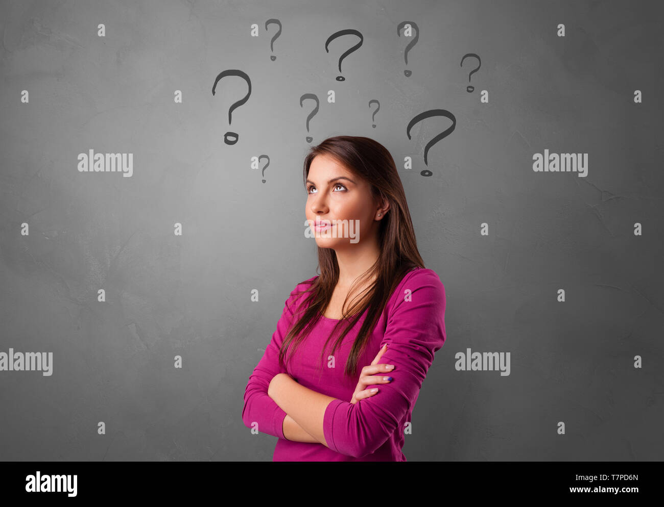 Person with question marks around face Stock Photo - Alamy