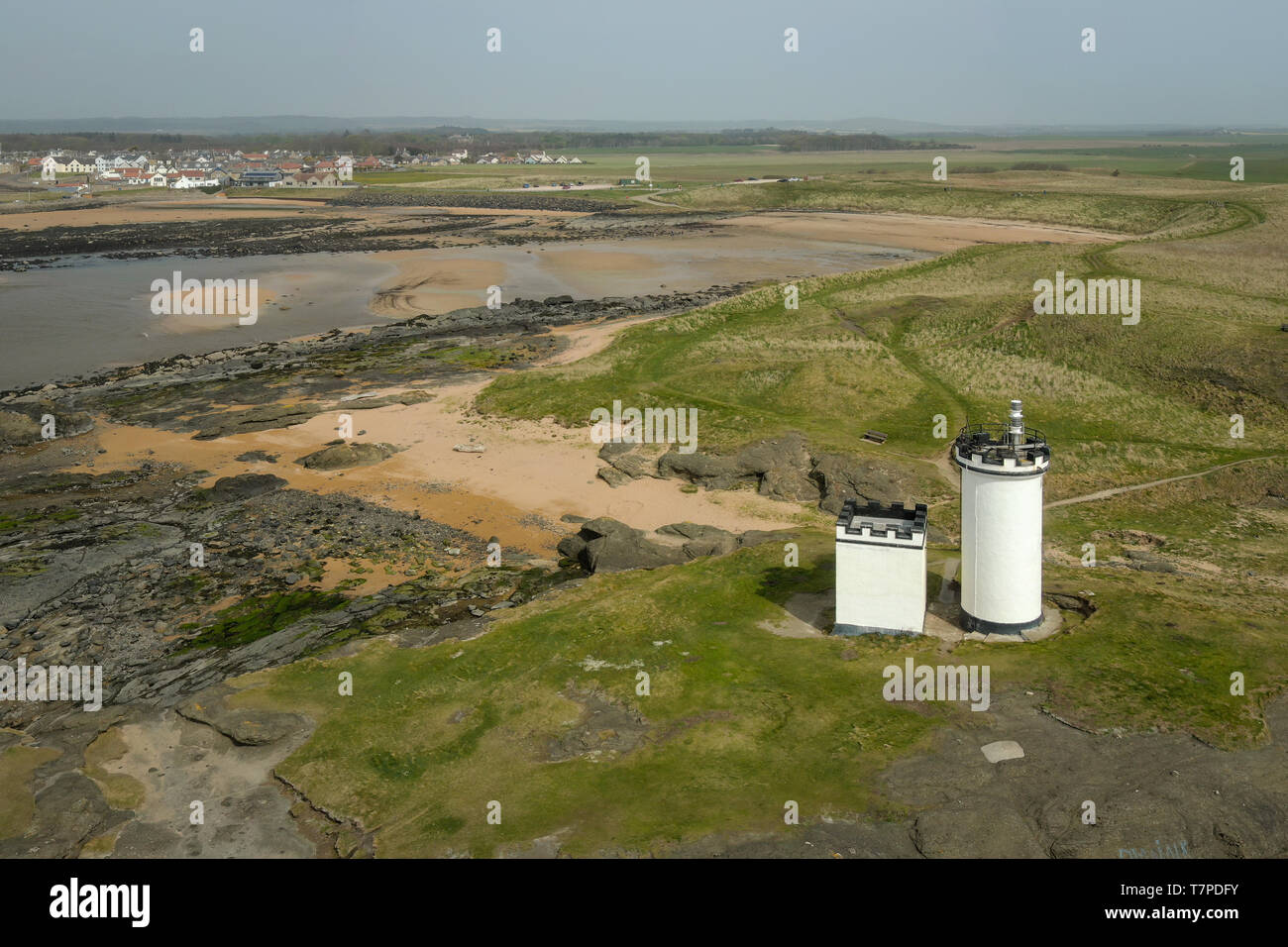 An aerial view of Elie Ness lighthouse and the surrounding coastal area ...