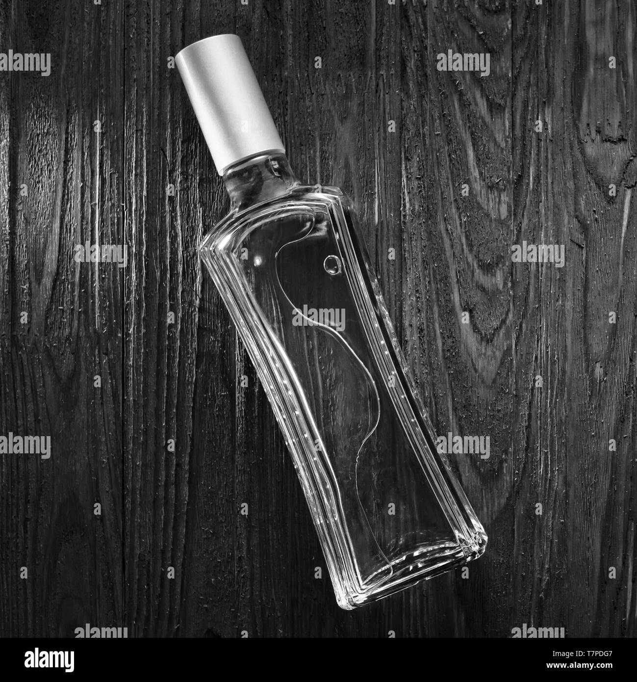 Luxury bottle of vodka on a wooden antique table. Top view, copy space ...