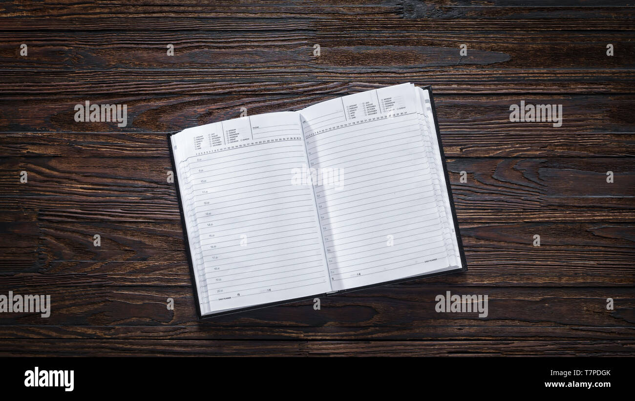 Open diary with blank pages on a wooden vintage table. Concept ...
