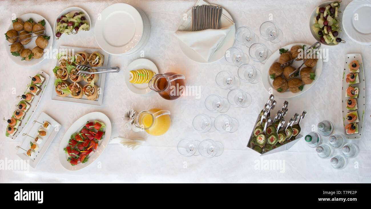 Food for a buffet on the table top view. Snacks. A festive table with ...