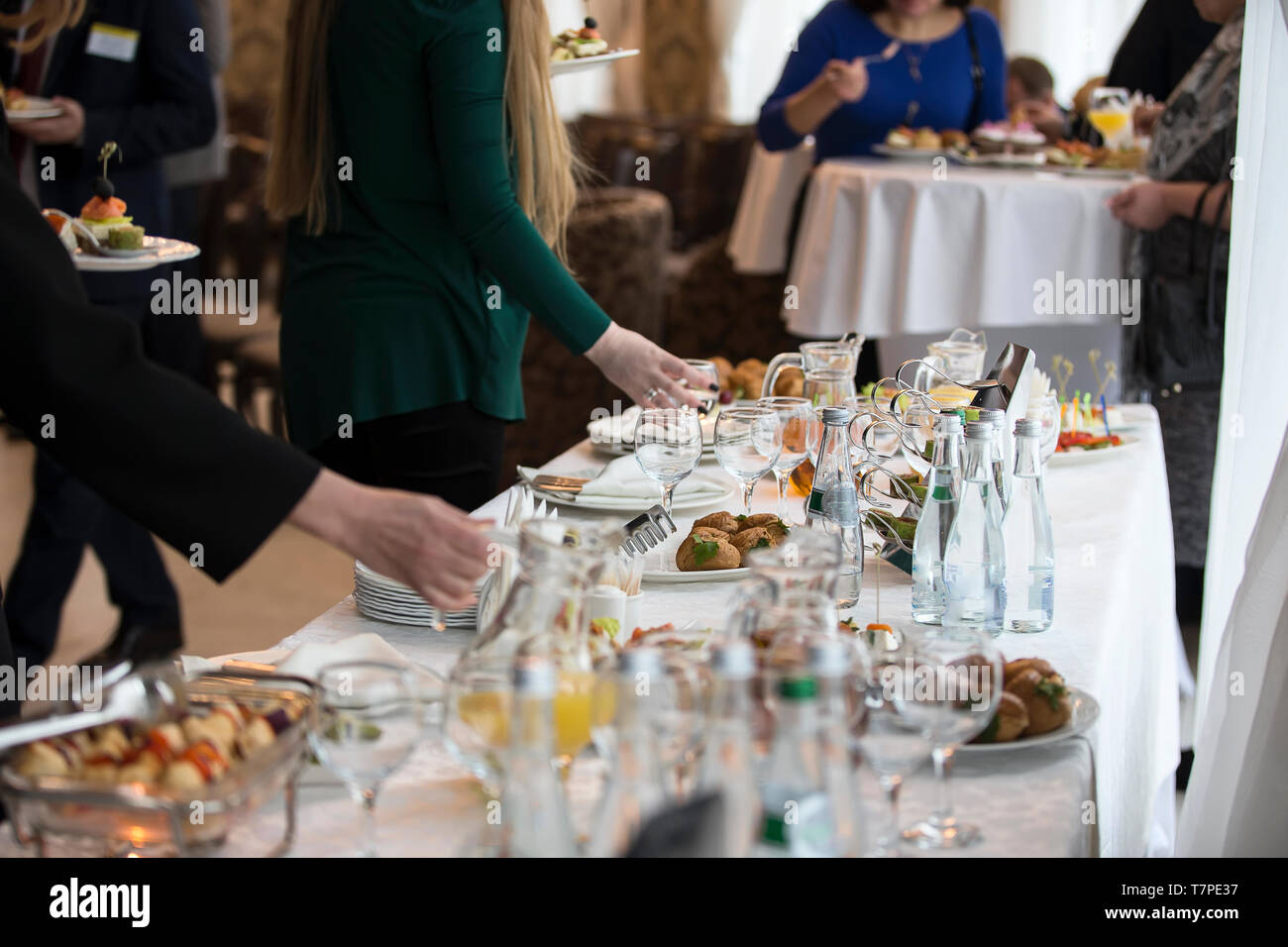 Buffet table with people Stock Photo - Alamy