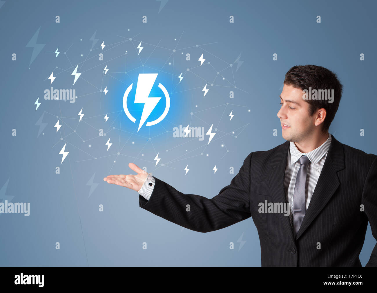 Young smiling person presenting battery life concept Stock Photo - Alamy