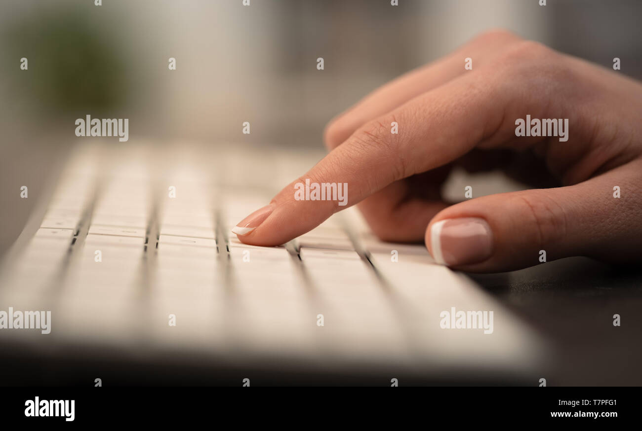 Hand typing on keyboard with office concept Stock Photo - Alamy