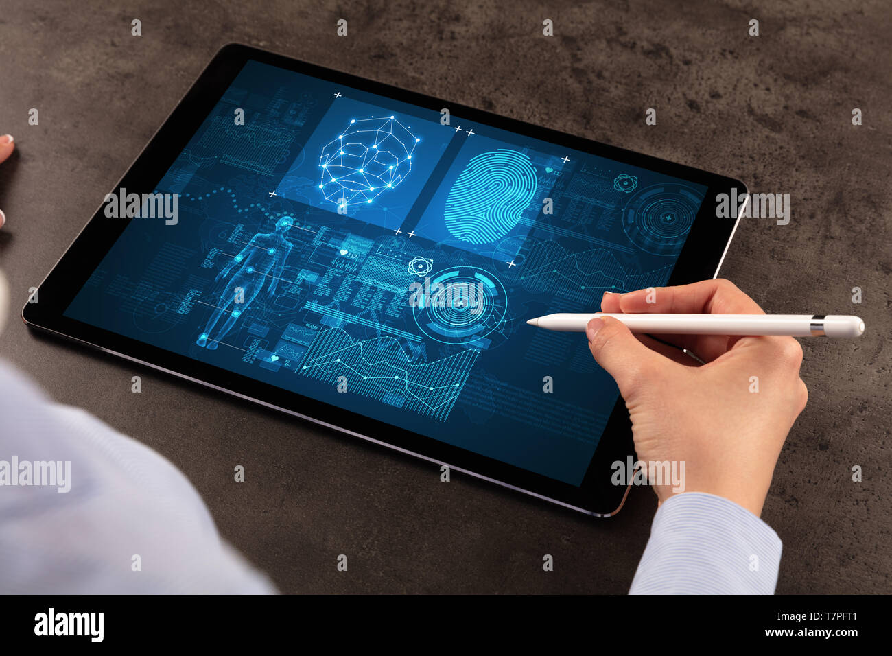 Business woman making analyses and checking fingerprints on tablet ...