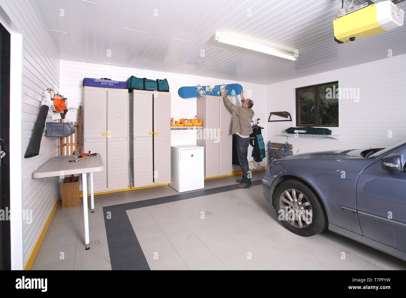 A domestic double garage fitted out with system-based storage ...