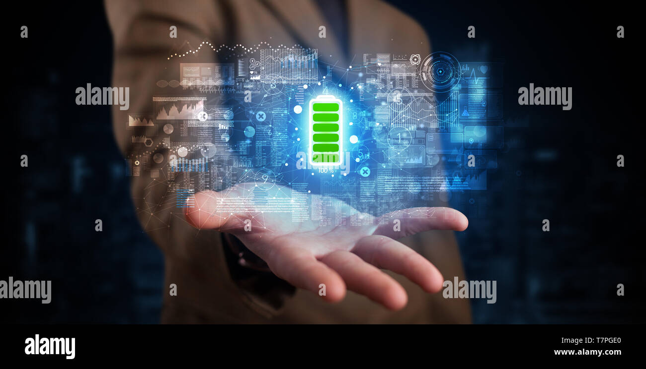 Elegant hand holding battery with full of energy Stock Photo - Alamy