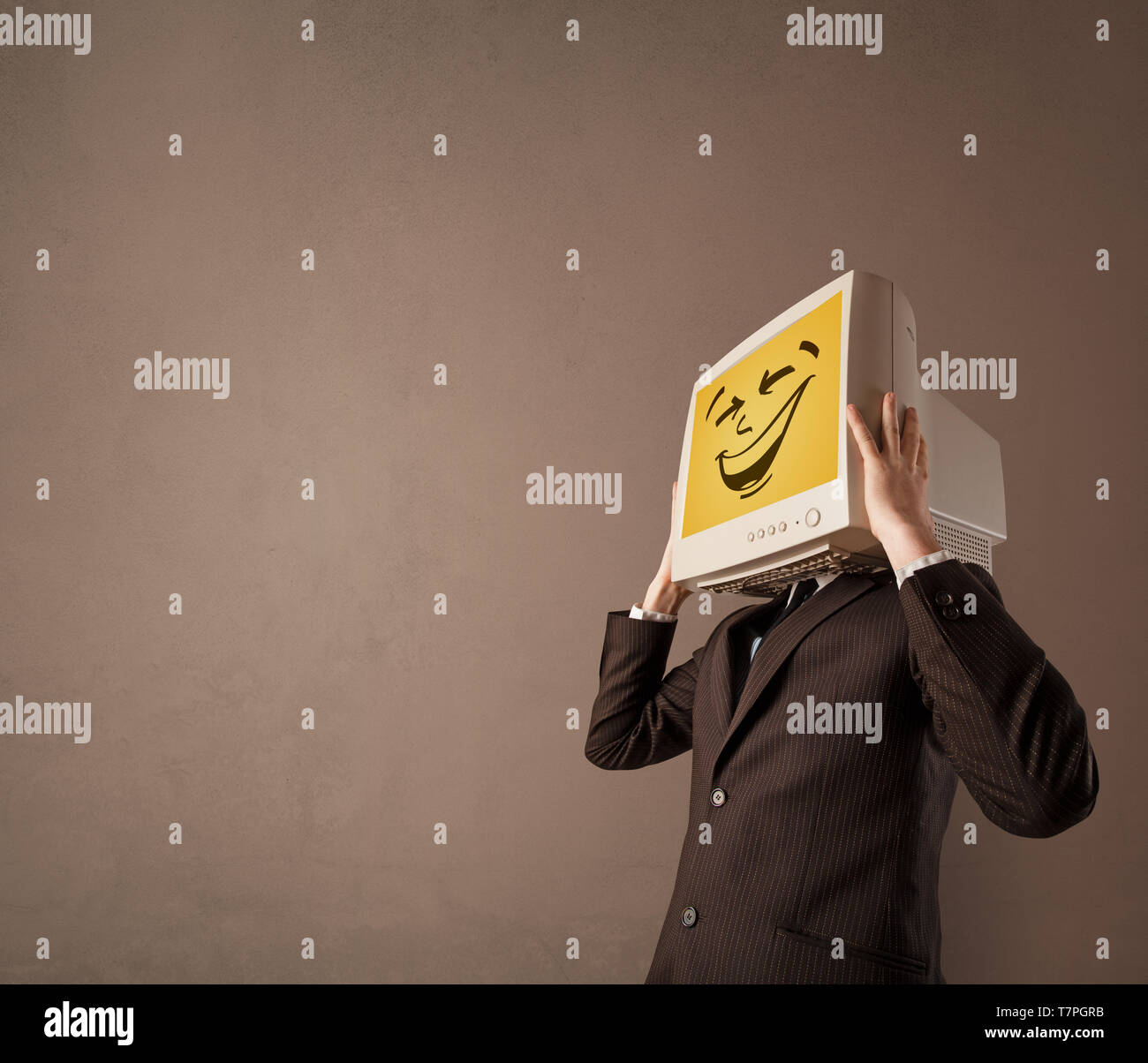 Young person with happy smiley monitor head Stock Photo - Alamy