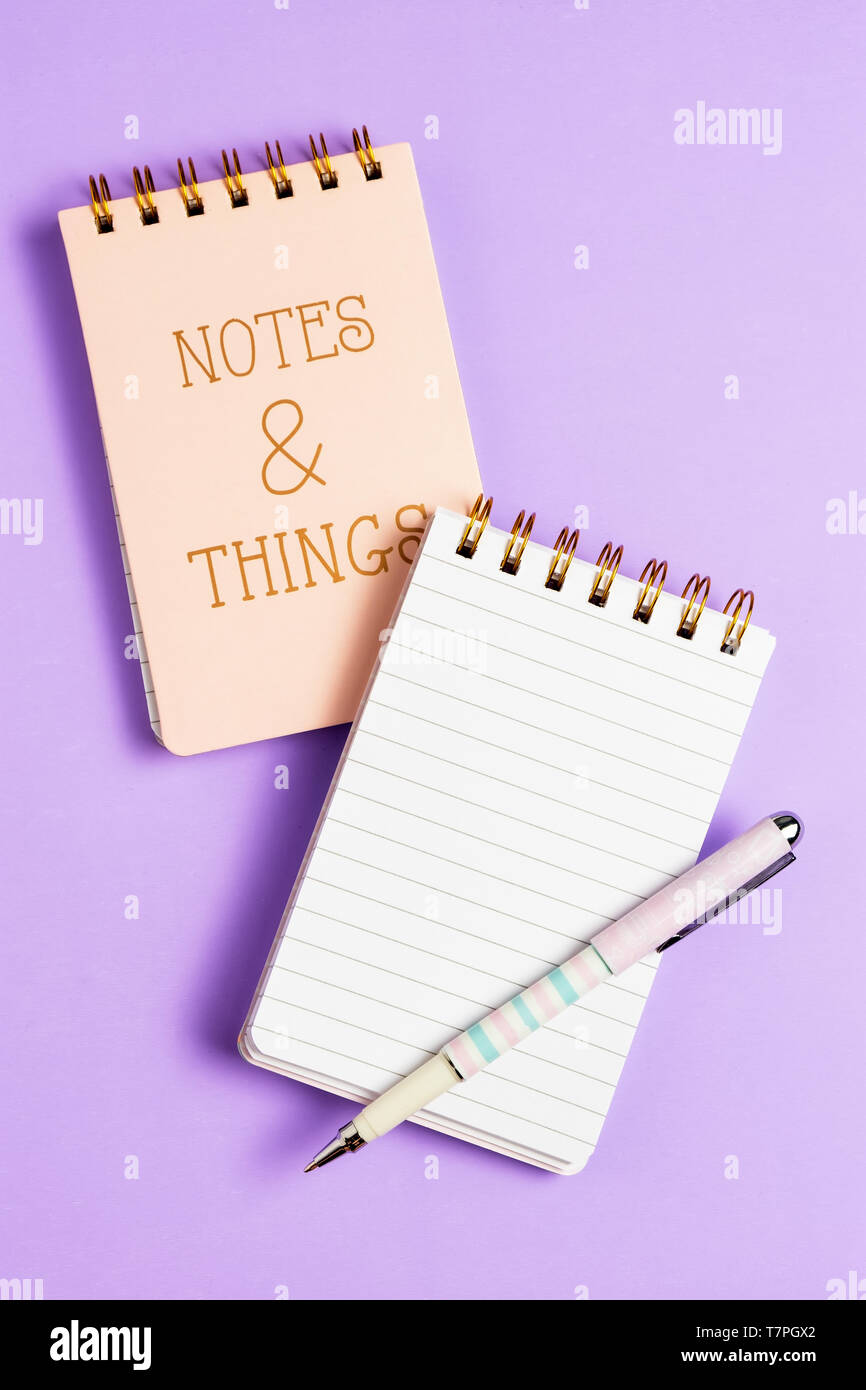 Top view of blank notebook with pen on purple pink pastel background ...