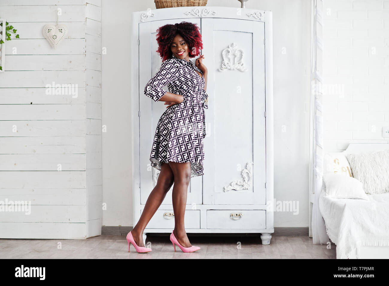 Fashionable tall african american model woman with red afro hair in ...