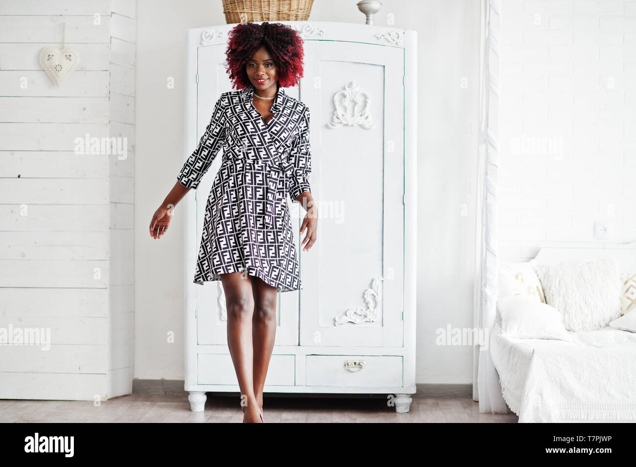 Fashionable tall african american model woman with red afro hair in ...