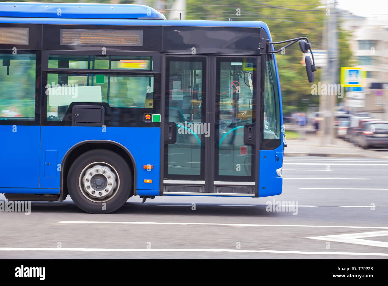 city bus goes along street Stock Photo - Alamy