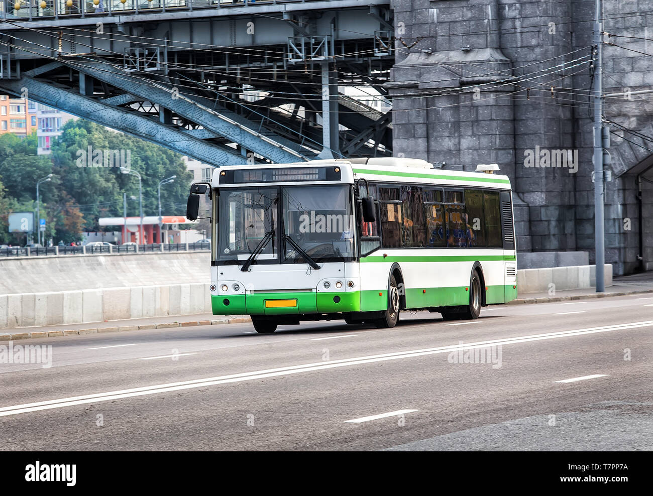 white city bus goes along street Stock Photo - Alamy