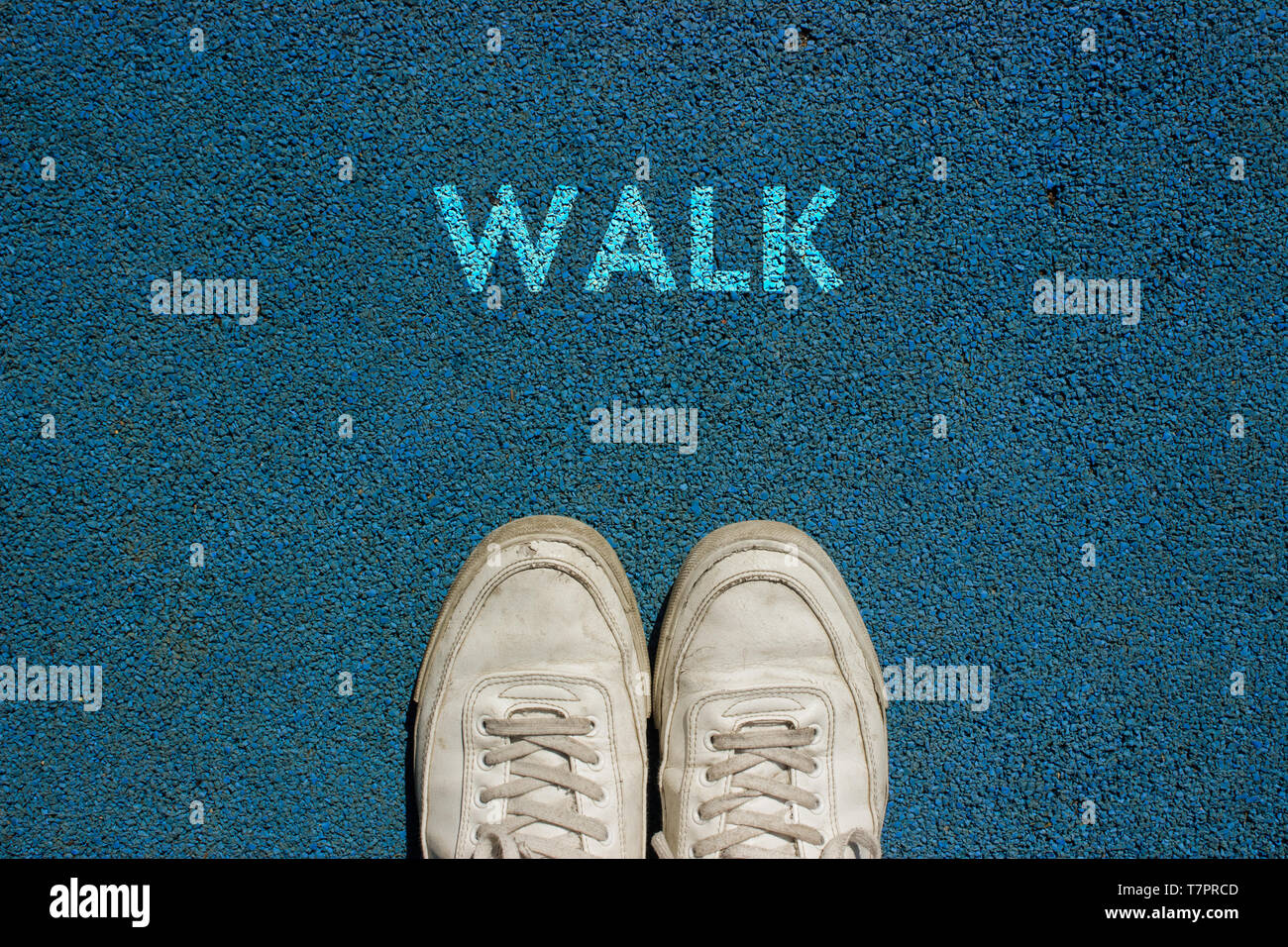 New life concept, Sport shoes and the word WALK written on walk way ...