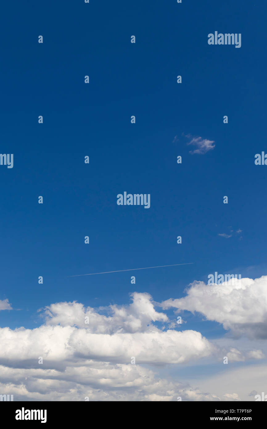 Colorful volumetric clouds on a bright sky. Optimistic look. Free space ...